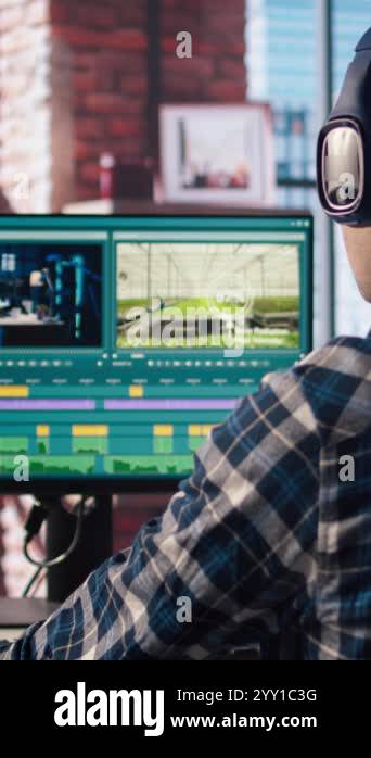 Video editor analyzing film montage, editing color grading and lighting ...