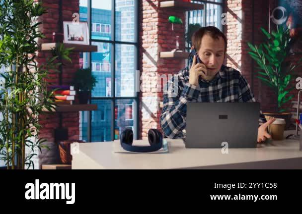 Manager at work arguing with employee during phone call after finding mistakes in spreadsheets ...