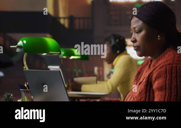 Portrait of african american librarian working in a peaceful public ...