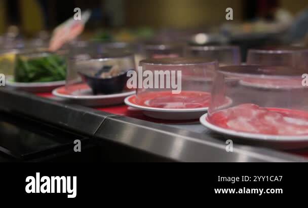 Sushi plates moving on a conveyor belt. High quality Stock Video ...