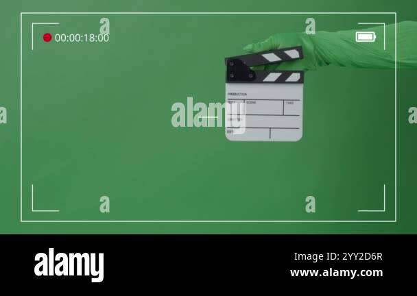 Movie Clapper board clapped by Hands on green screen camera background ...