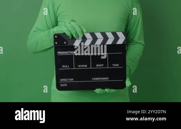 Movie Clapper board clapped by Hands on green screen camera background ...