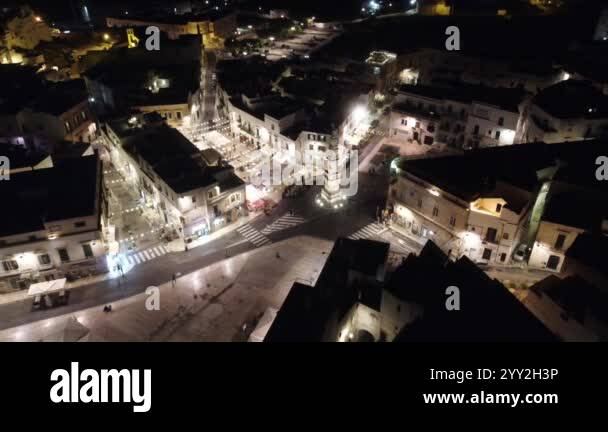 4K drone footage of Ostuni, Italy, at night. The video highlights the ...