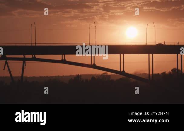 A stunning sunset paints the sky with vibrant hues, creating an ...