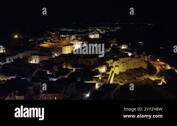 4K drone footage of Ostuni, Italy, at night. The video highlights the ...