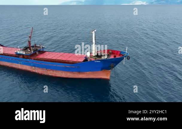 Large cargo ship at sea with blue and red hull in corfu ,Greece Stock ...