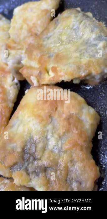 Fried fish in a frying pan in batter, oil, frying, fire, delicious ...