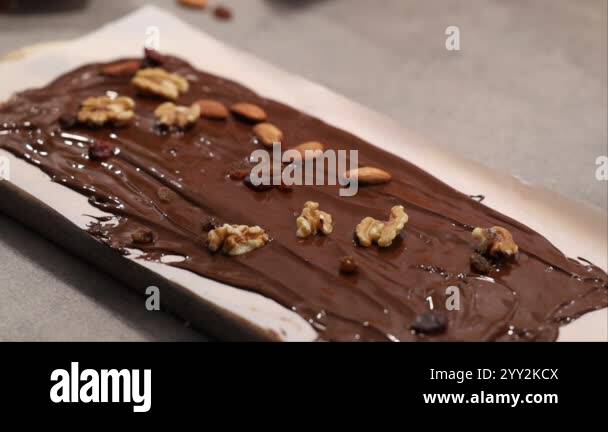 Stockholm, Sweden A baker spreads melted chocolate onto wax paper to ...