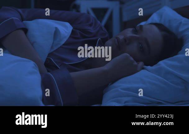 Woman at night suffering of insomnia, not able to sleep in bed Stock ...