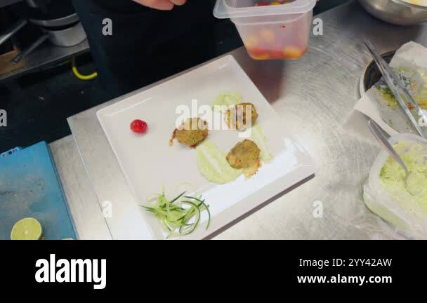 Plating Of A Raw And Cooked Fish Based Appetizer In A Luxury Italian ...