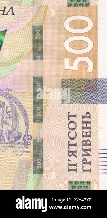 Vertical video focusing on right side of 500 UAH banknote, showcasing ...