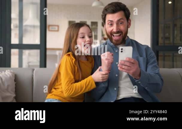 Happy smiling Caucasian family father man dad hold mobile phone child ...