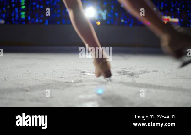 Dancing on ice, professional gymnast performs a trick on ice, female ...