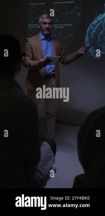 Vertical shot of middle-ages neuroscientist holding digital tablet ...