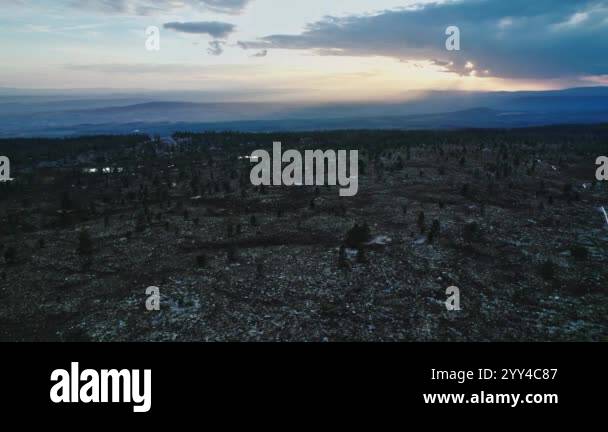 Experience a stunning summer evening as a drone glides over a mountain ...