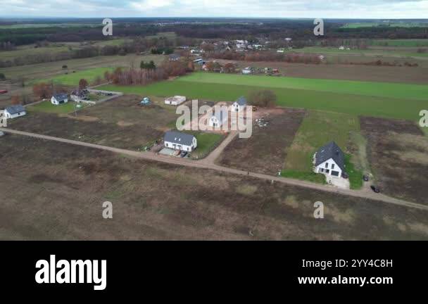 New houses in shell condition in the countryside. Shots from the air ...