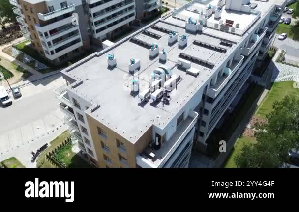 Hvac equipment and solar panels are installed on the rooftop of a ...