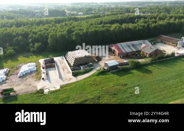 Green farm with hay bales and silage storage for winter feed Stock ...
