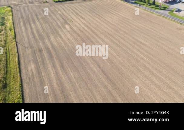 Empty plowed field ready for planting from high above Stock Video ...