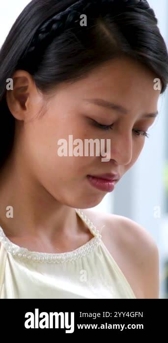 sad face of asian girl beautiful female in light dress on street ...