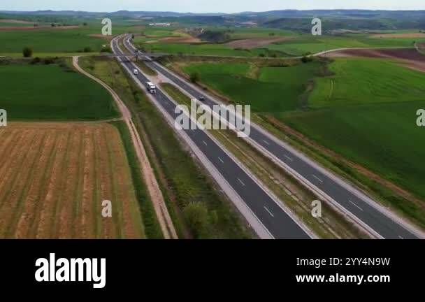 Aerial 4k hyperlapse of traffic driving on a country road highway while ...