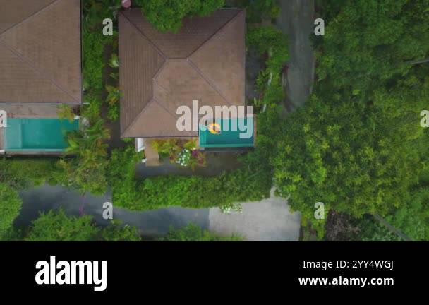 Relax on a yellow pool float in a tropical resort. Enjoy sunbathing in ...