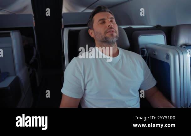 Scared Male Passenger Looking Out The Window Airplane. Man having a ...