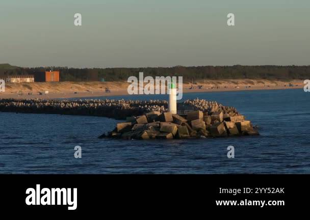 Sandy coastal beach sunrise lighthouse background Stock Videos ...