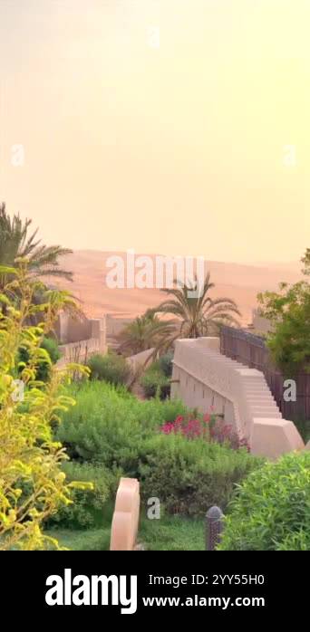 Modern building with heritage-like design elements is enveloped by lush ...