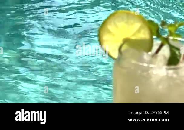 Iced mint tea in glass by pool offers ultimate summer refreshment ...
