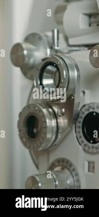 Close-up of an optometrists phoropter machine, used for eye exams, with ...