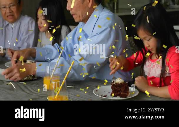 Family eating cake and drinking juice with confetti animation ...