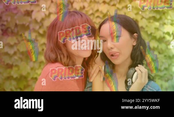 Pride text and peace sign animation over two women posing outdoors ...