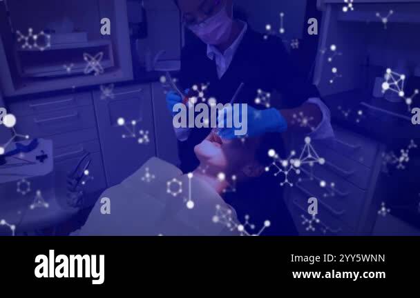 Treating patient, dentist working with molecular structure animation in ...