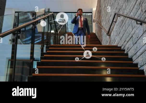 Using smartphone, businessperson walking down stairs with network of ...