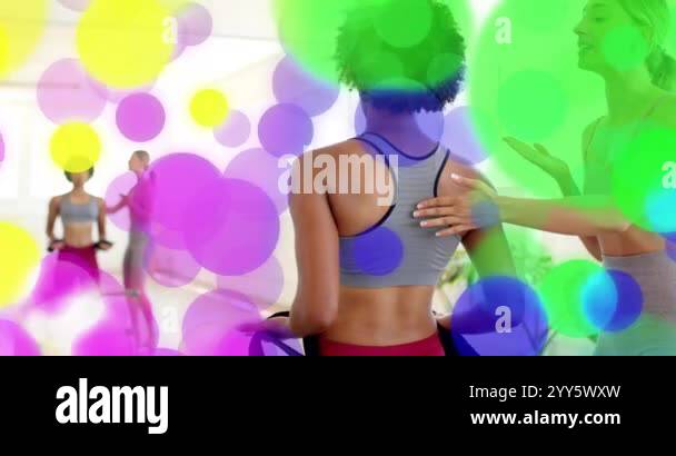 Exercising in fitness studio, women surrounded by colorful bokeh animation. exercise, wellness ...