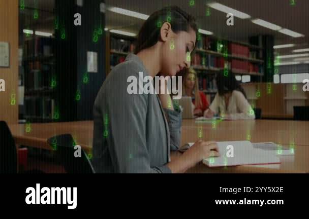 Binary code animation over students studying in school library ...