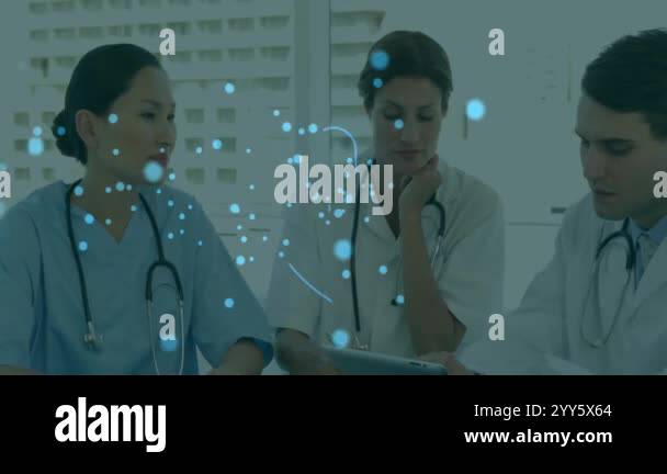 Discussing patient data on tablet, doctors with cybersecurity lock ...