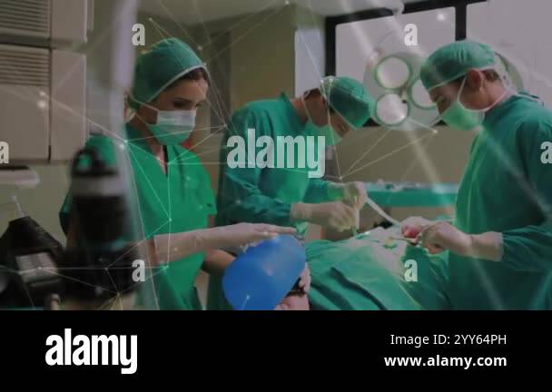 Performing surgery over network connections, medical team collaborating ...