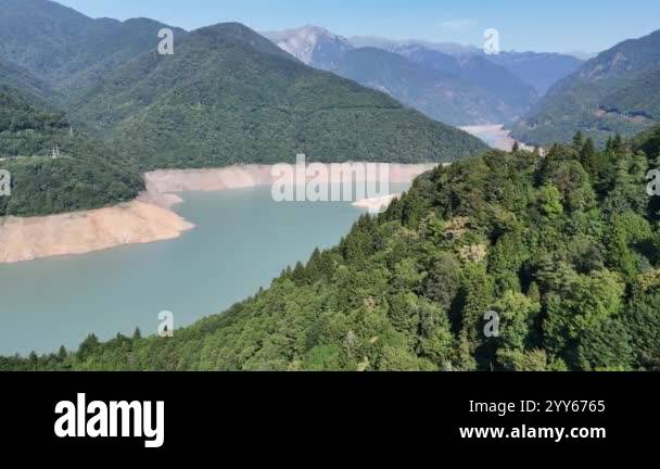 Aerial view of wooded hills and Jvari reservoir on Inguri river in ...