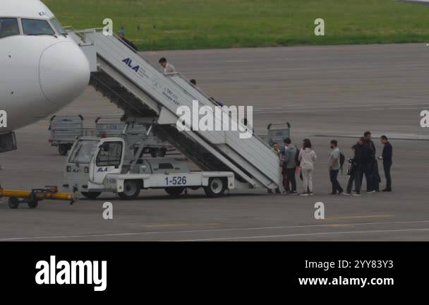 ALMATY, KAZAKHSTAN - MAY 10, 2024: Group of people standing in queue at ...