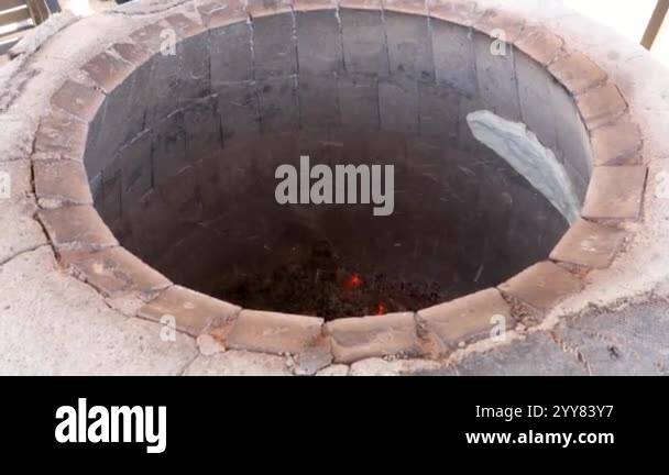 Traditional Georgian Shoti bread is baked in a hot ceramic oven Stock ...