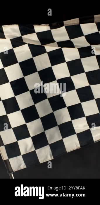 Super Slow Motion of Checkered Race Flag Waving Continuously in the ...