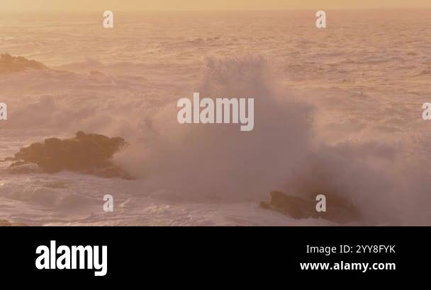 Epic slow-motion video of ocean waves crashing onto rocky terrain at ...