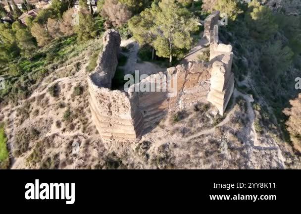 Aerial view of the remains of the medieval Castillo de la Luz on a hill ...