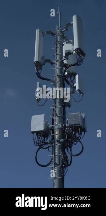 A modern telecommunication tower equipped with various antennas and ...