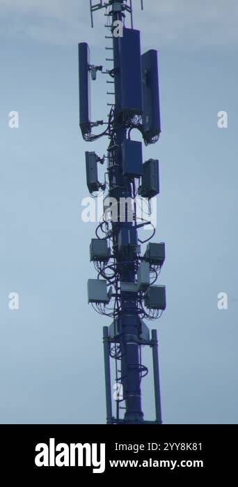 A very tall telecommunications tower equipped with multiple antennas designed for effective ...
