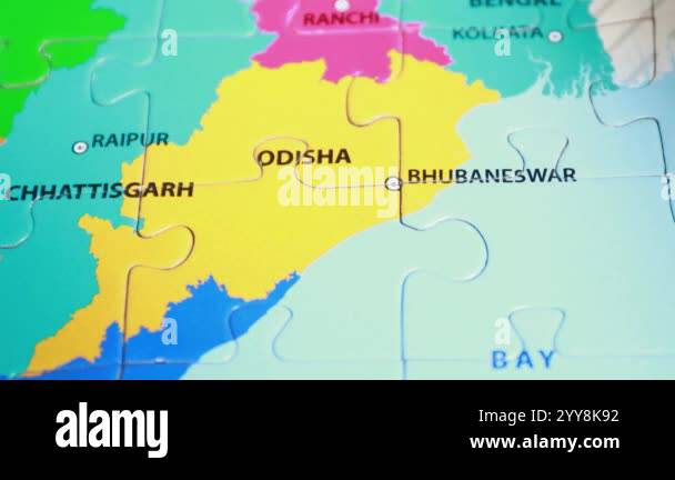 A human hand with a map pin pointing Bubaneswar - the capital of Odisha ...