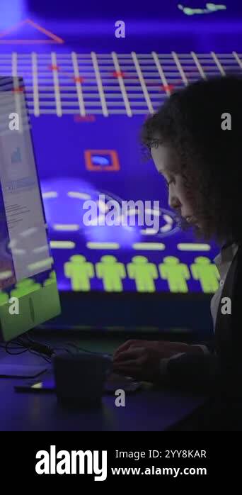 An individual deeply focused on coding, surrounded by a vibrant digital ...