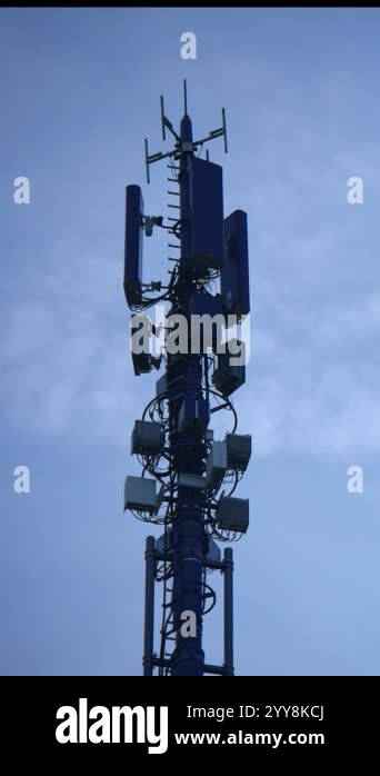 Here is a detailed view showcasing a modern cell tower standing tall ...
